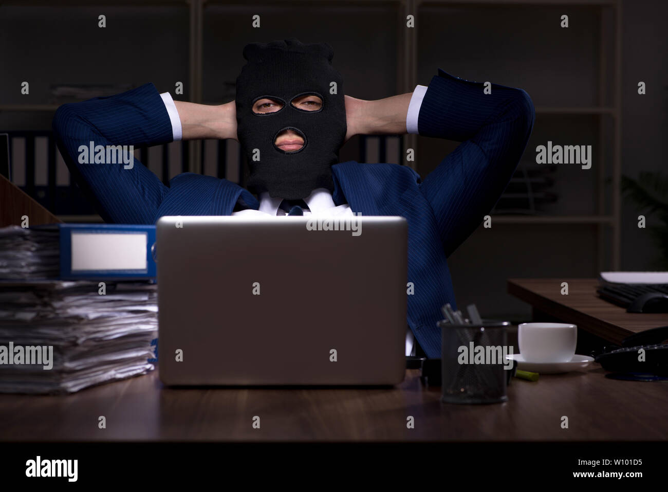 Male employee stealing information in the office night time Stock Photo ...