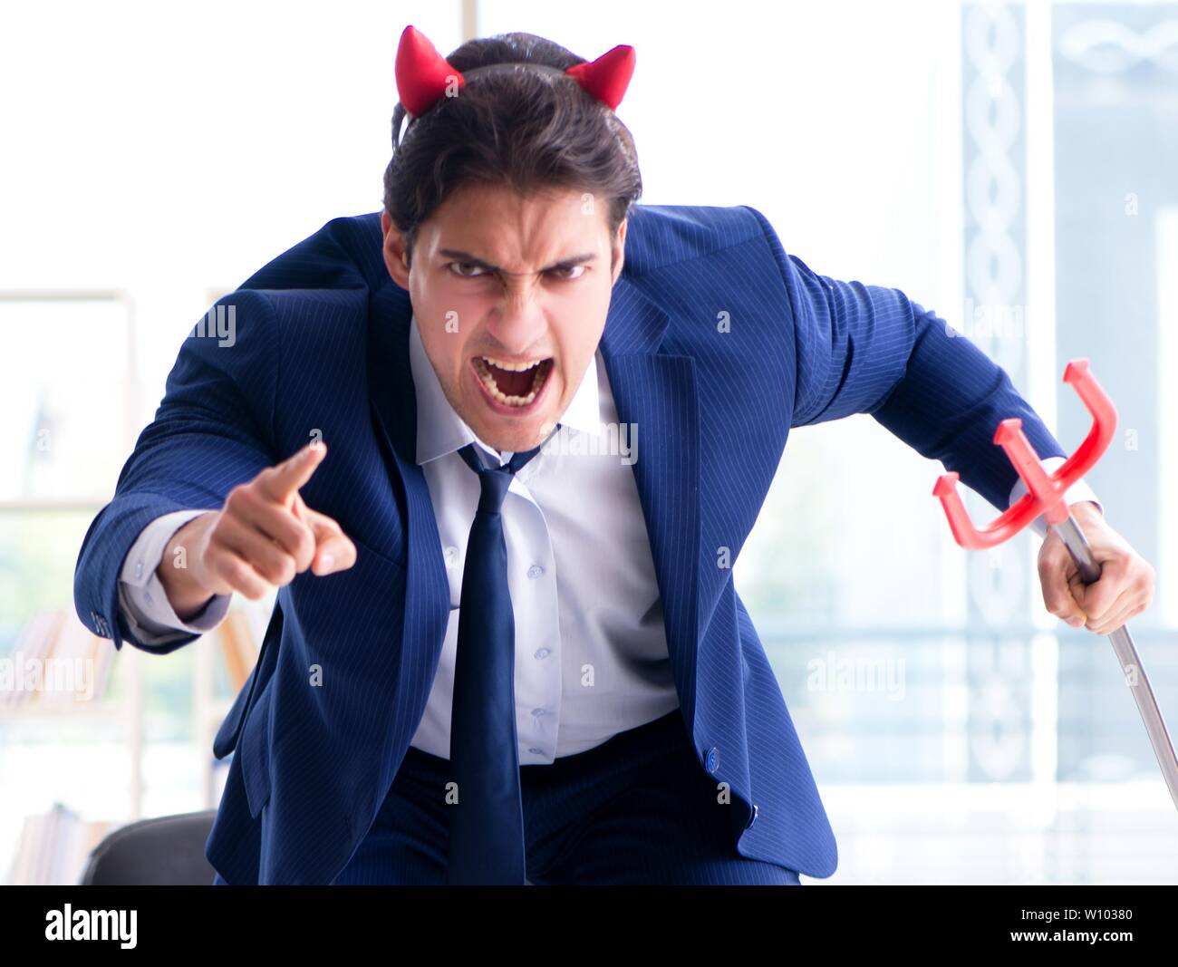 Devil angry businessman in the office Stock Photo - Alamy