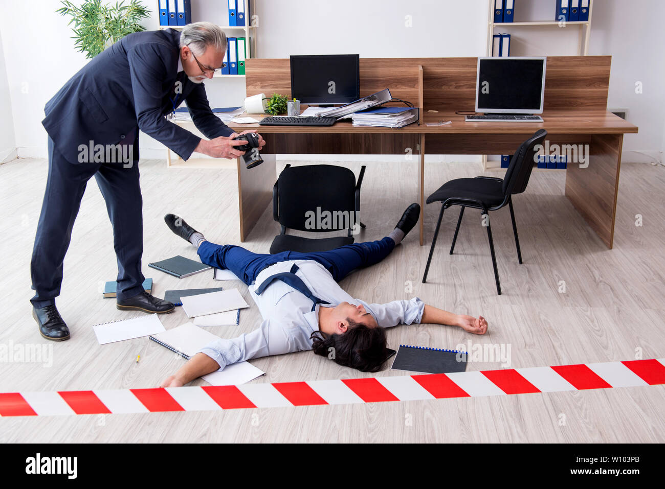 Forensic investigator and dead employee in the office Stock Photo - Alamy