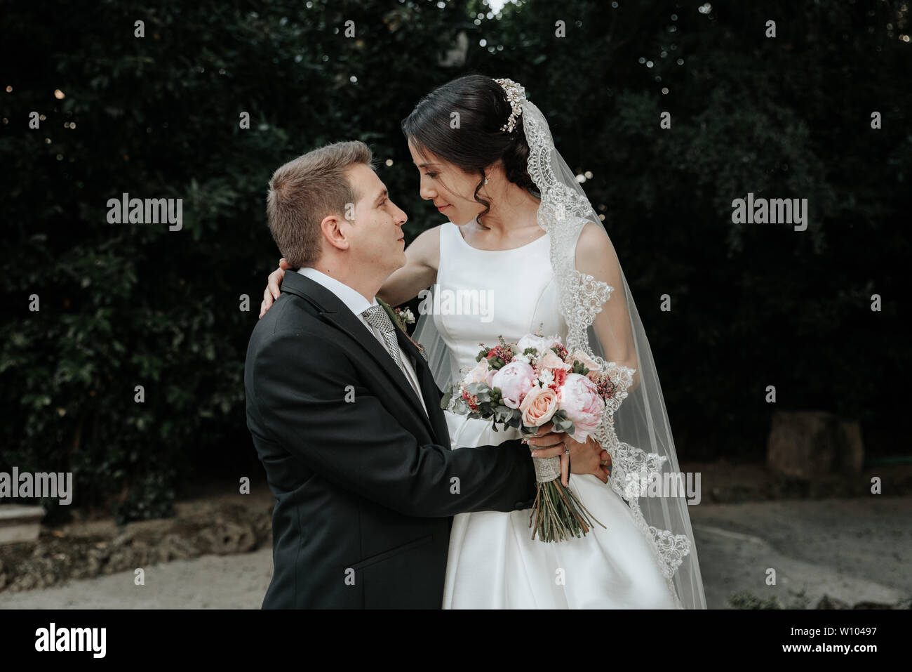 Wedding couple in the evening. Peaceful romantic moment Stock Photo - Alamy