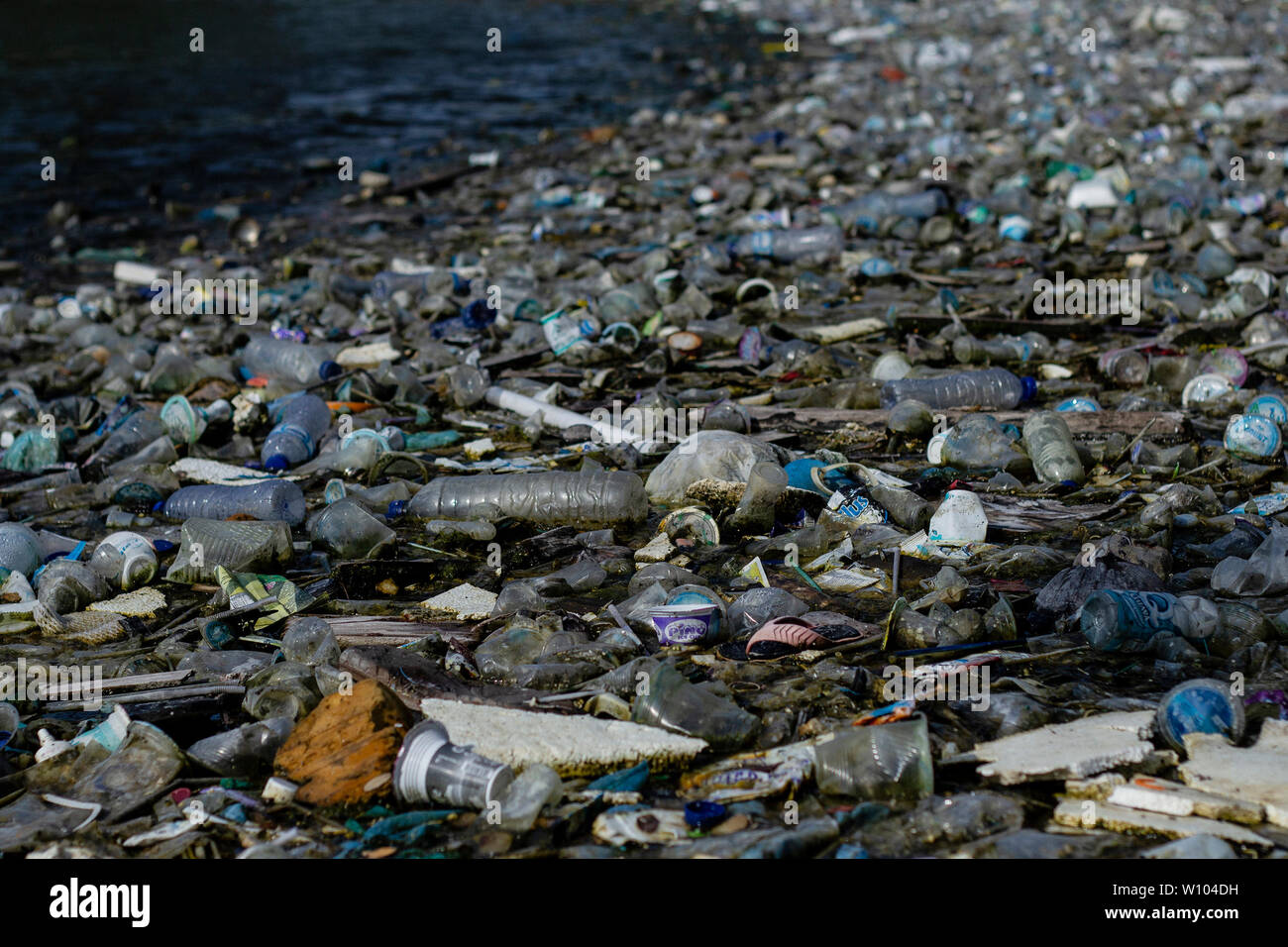 A view of the plastic waste that pollutes the reservoir area in ...