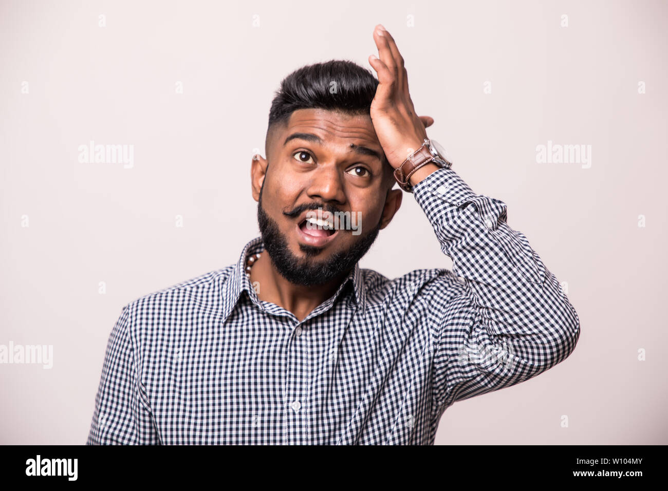 Annoyed indian man slapping hi-res stock photography and images - Alamy