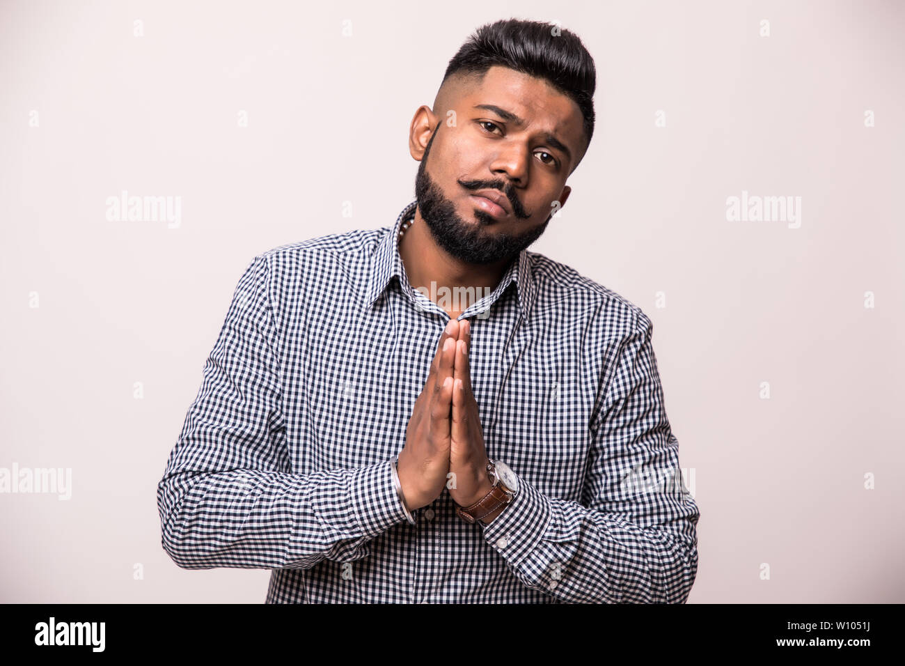 Indian man thinking hand for pray isolated on white background Stock ...