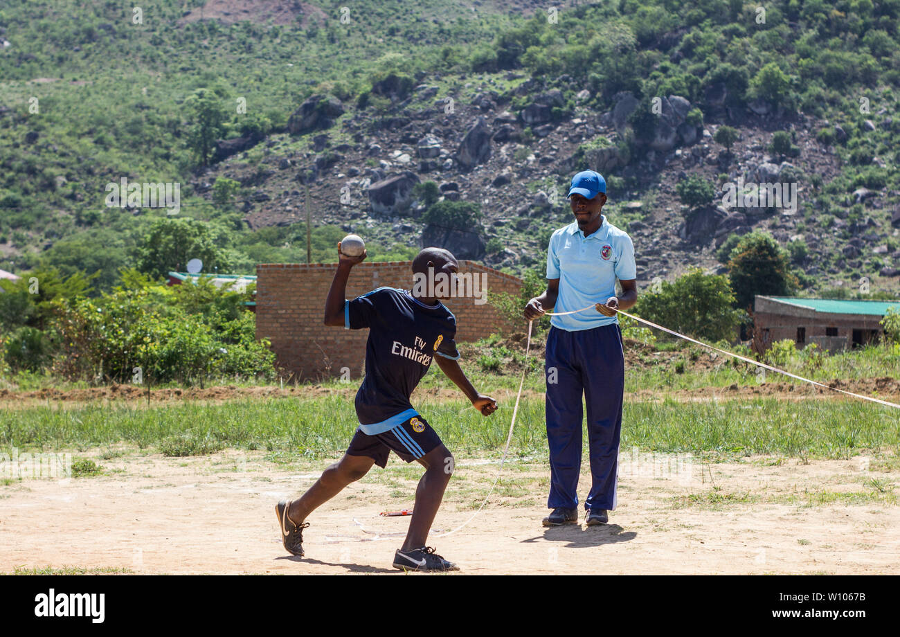Pupil throwing a sphere in the shot put category in their physical ...