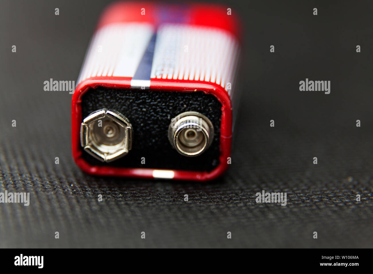 close up of a red and white square battery Stock Photo - Alamy