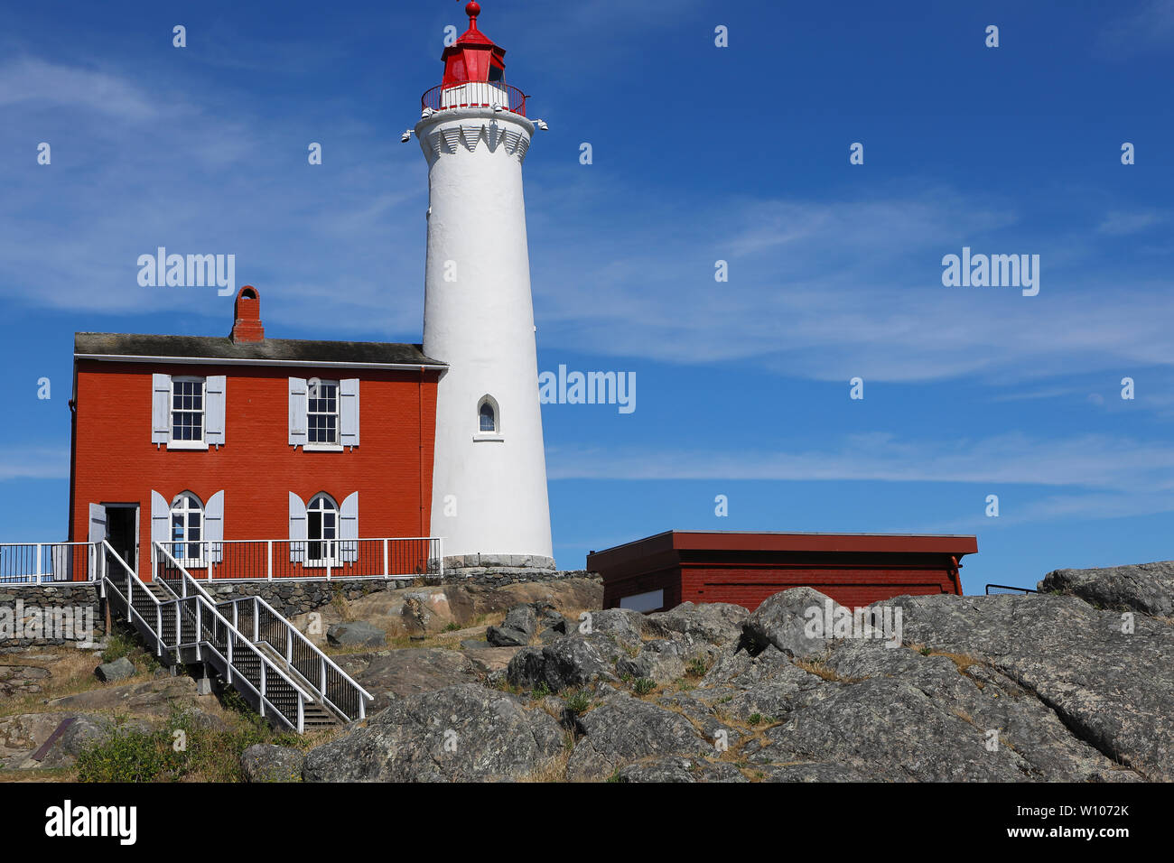 A close up of FIsgard Lighthouse under a clear sky in Victoria BC ...