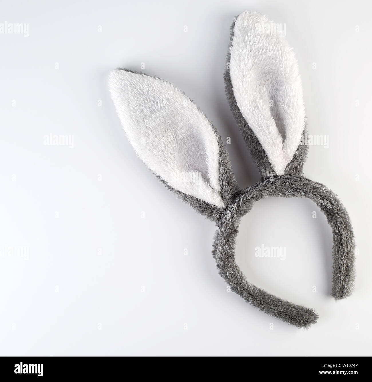 Fur headdress of a hare with ears on a white background, a festive ...