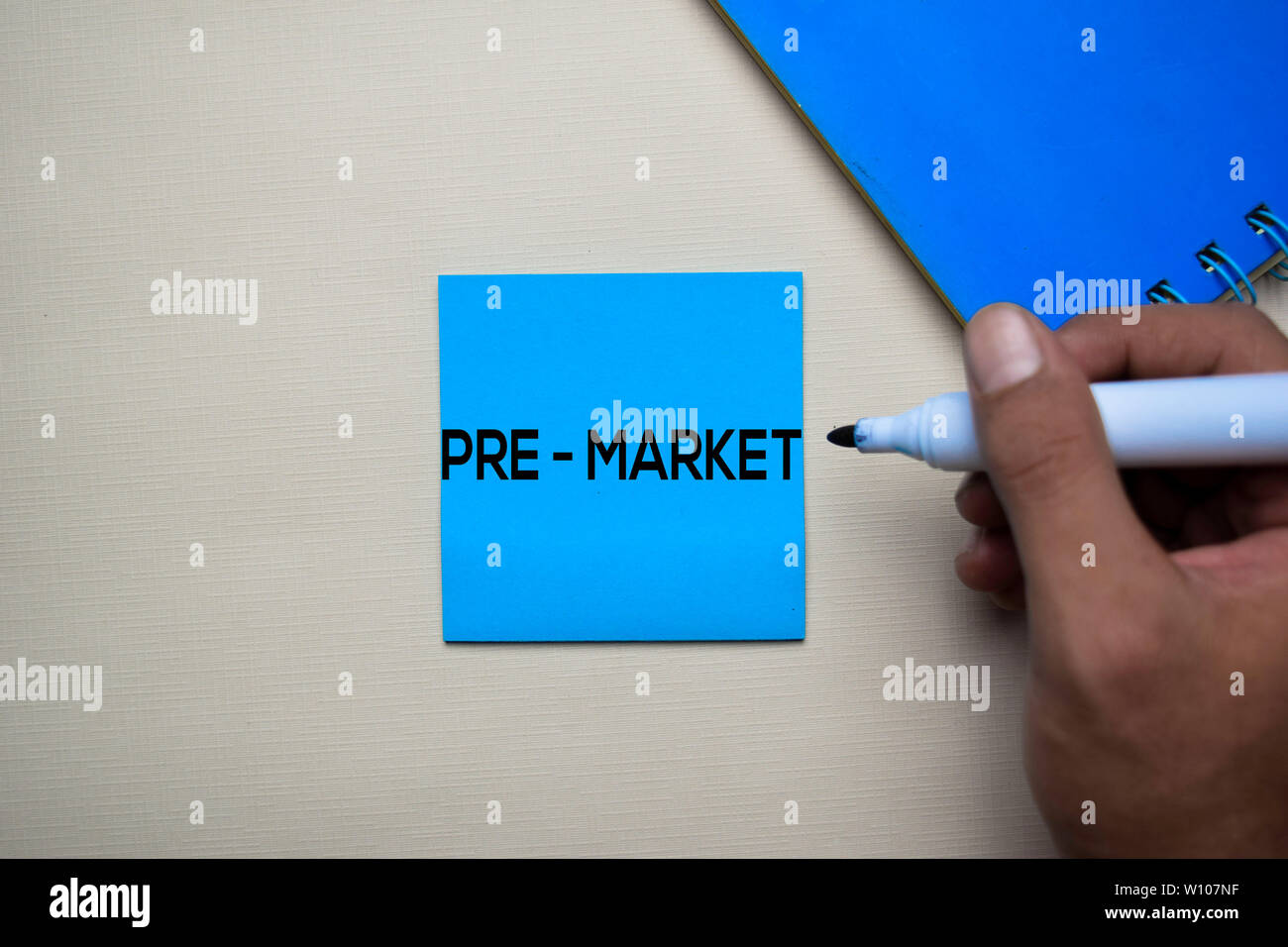 Pre - Market text on sticky notes with office desk. Stock Market ...
