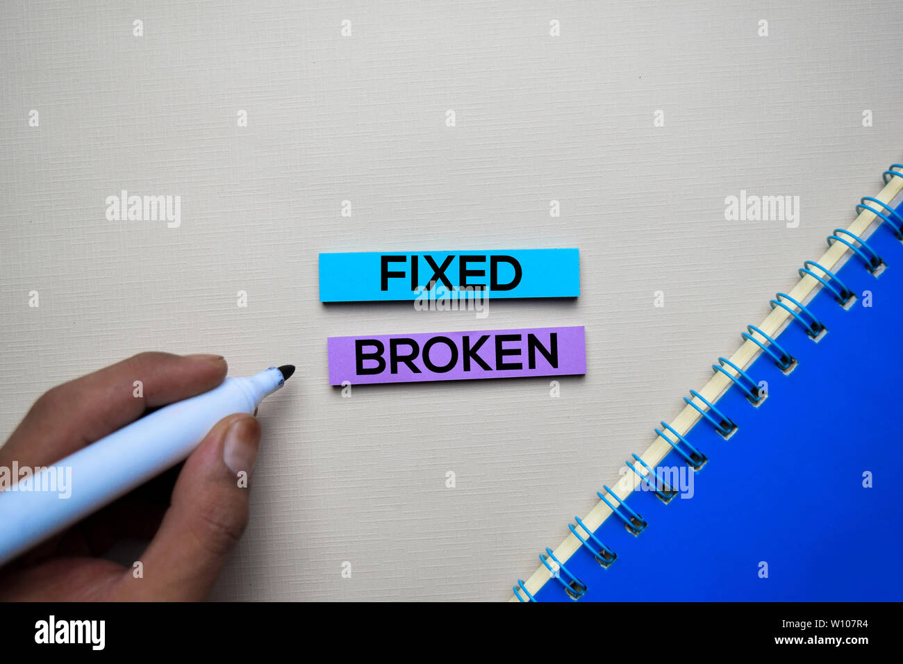 Fixed or Broken text on sticky notes with office desk concept Stock ...