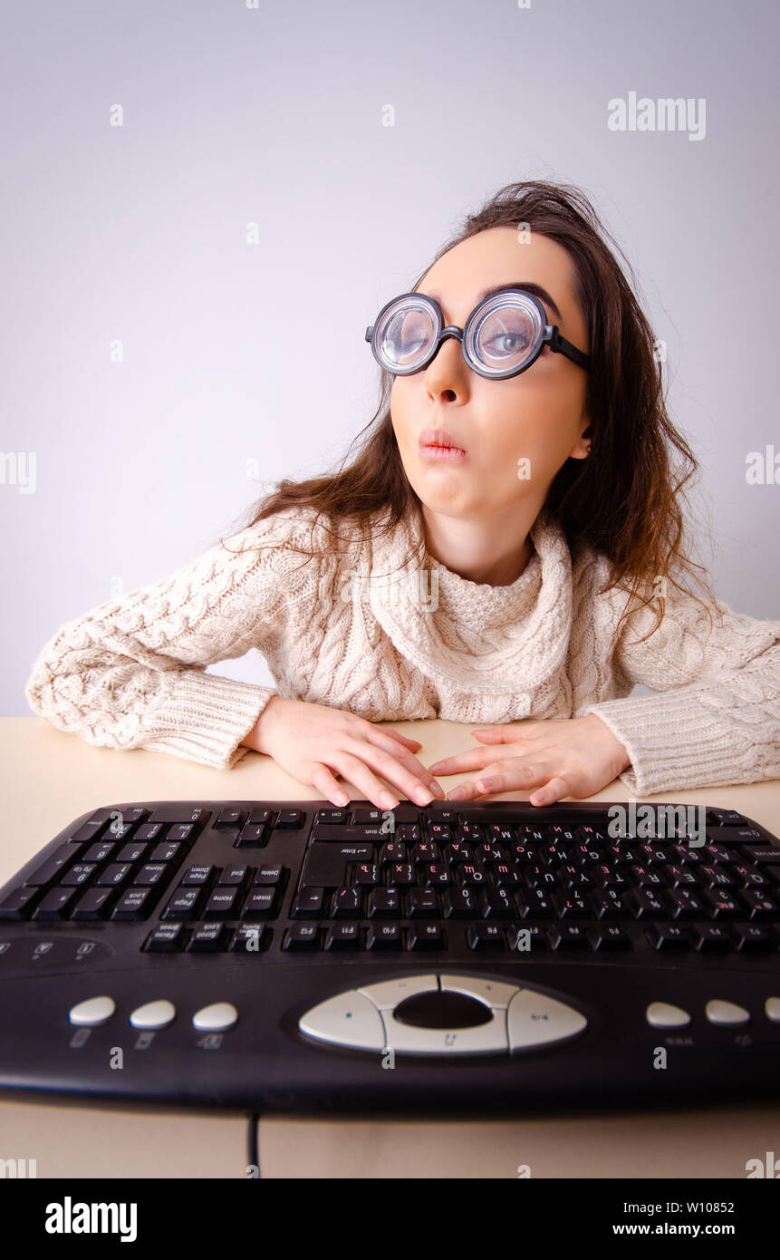 Funny nerd girl working on computer Stock Photo - Alamy