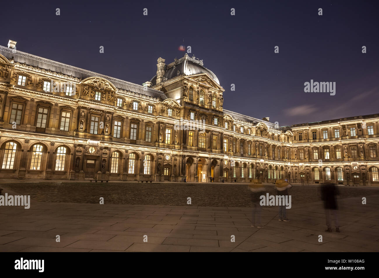 Louvre Museum in Paris at nightis. A central landmark of Paris, France ...
