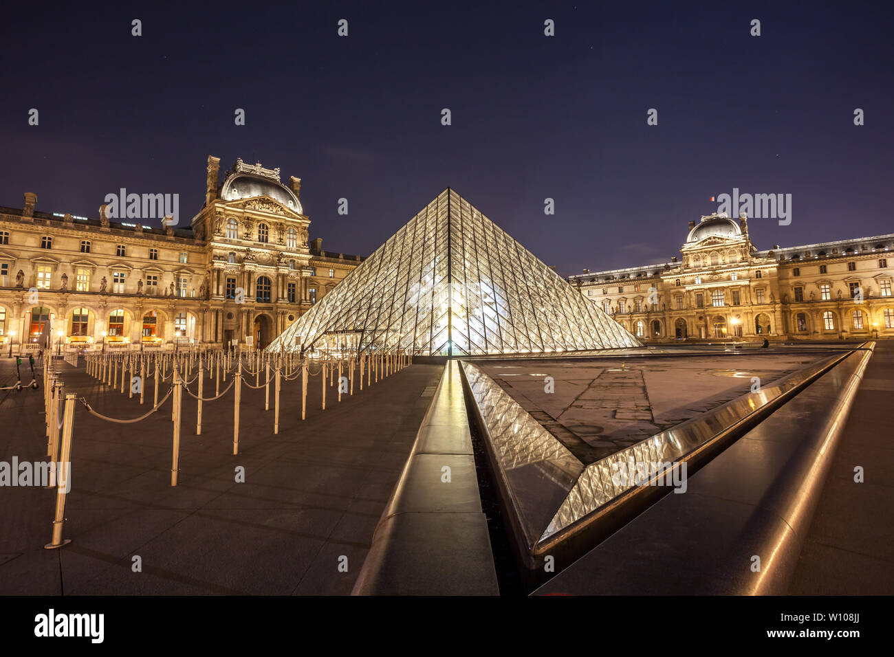 Louvre Museum in Paris at nightis. A central landmark of Paris, France ...