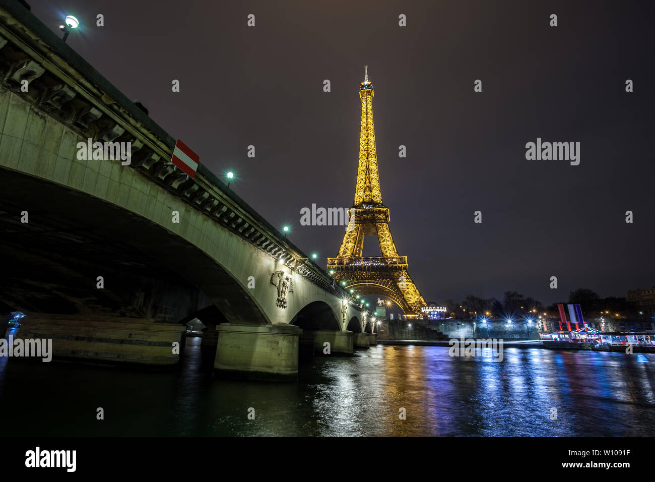 Night view of Eiffel Tower, a iron tower on the Champ de Mars in Paris ...