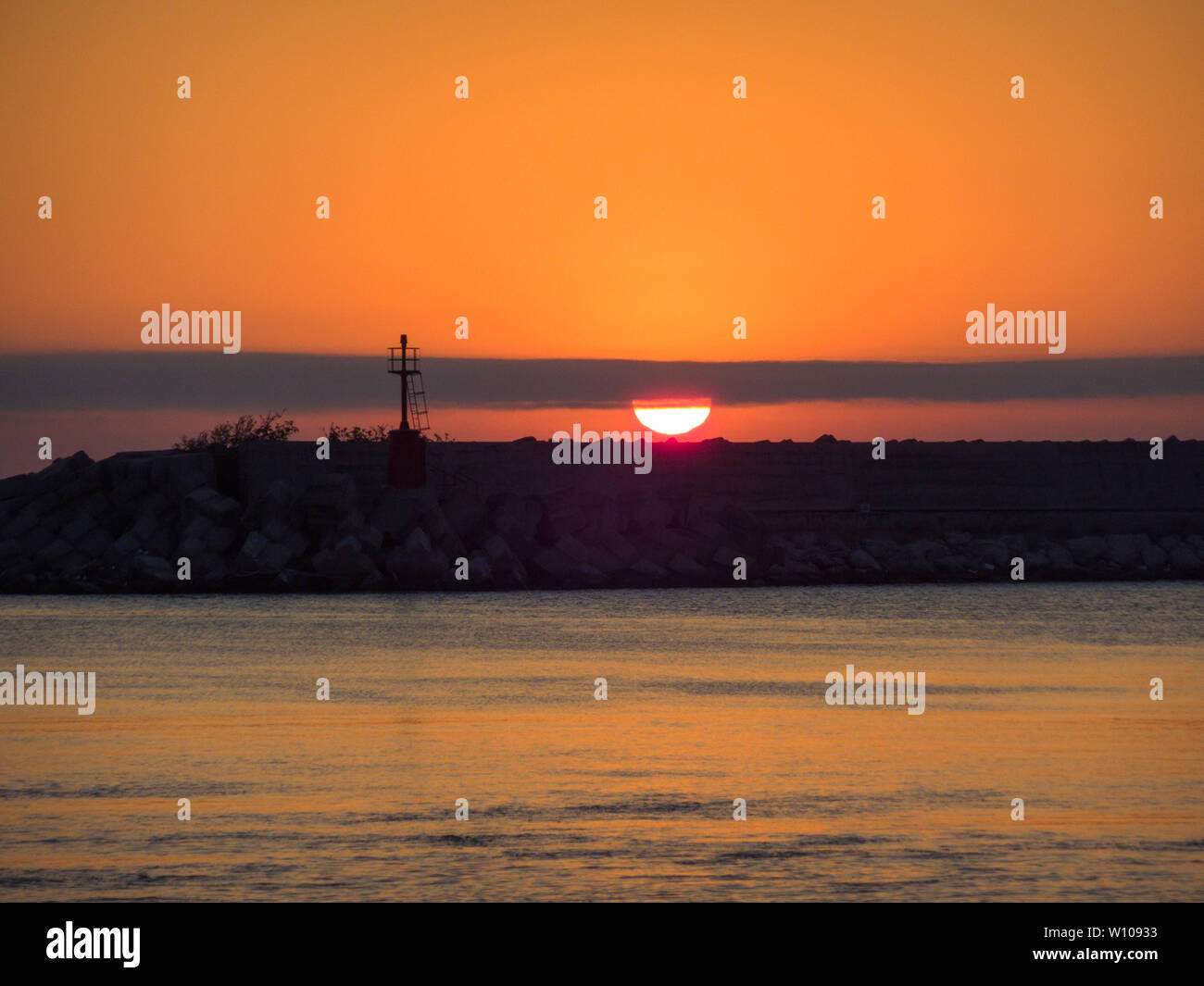 the sun rising from the sea Stock Photo - Alamy