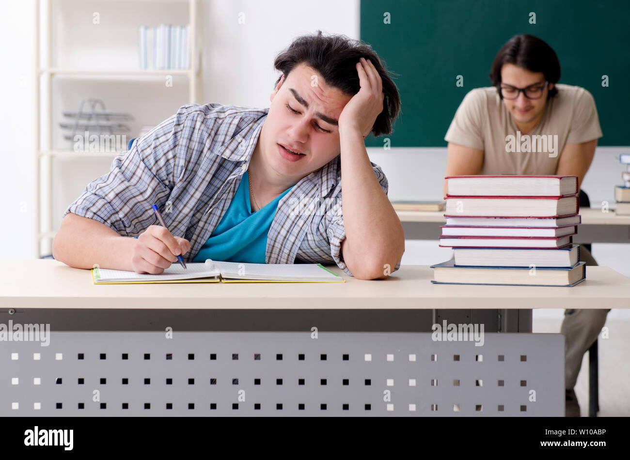 Two male students in the classroom Stock Photo - Alamy