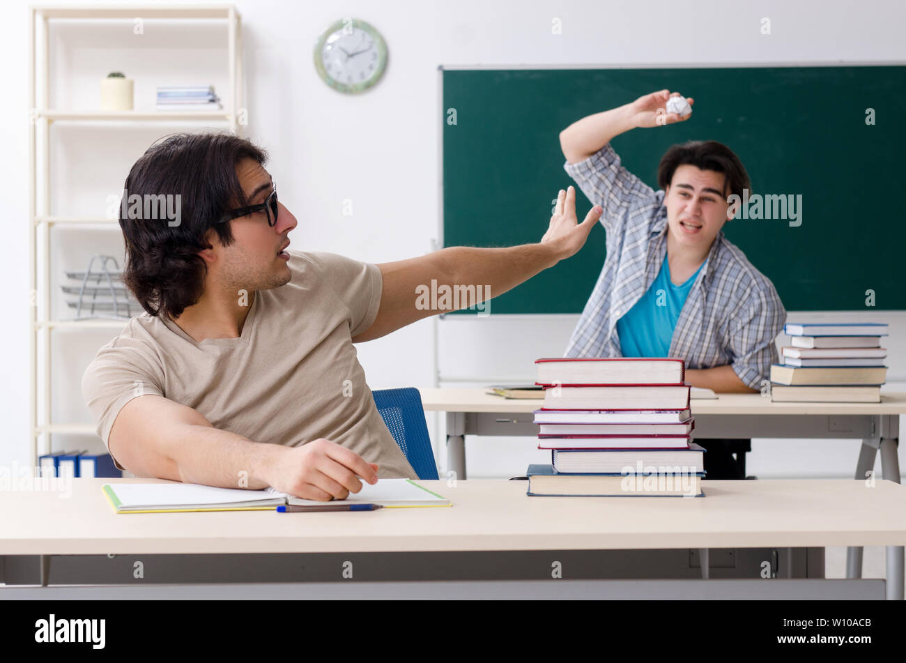 Two male students in the classroom Stock Photo - Alamy