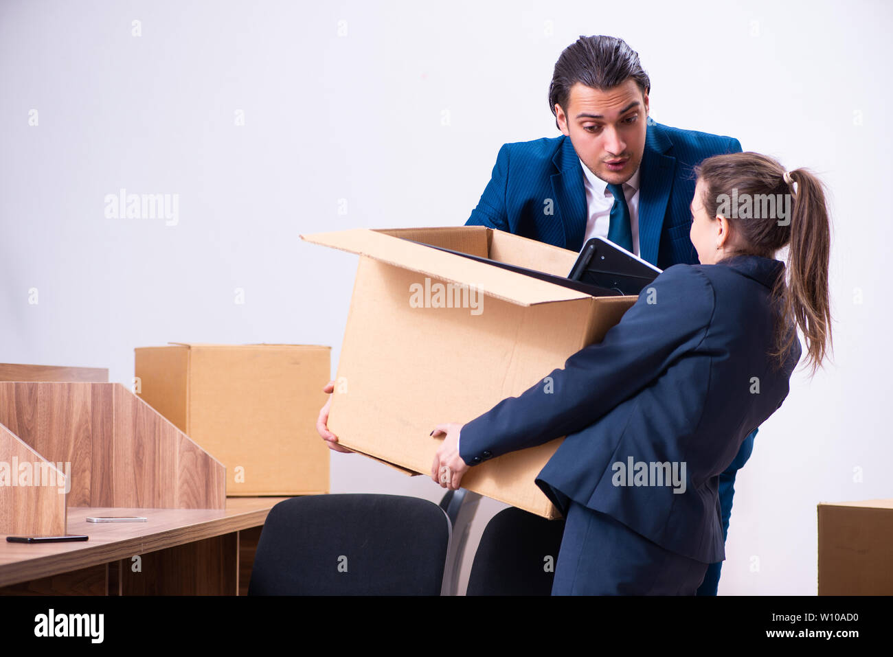 Two employees being fired from their work Stock Photo - Alamy