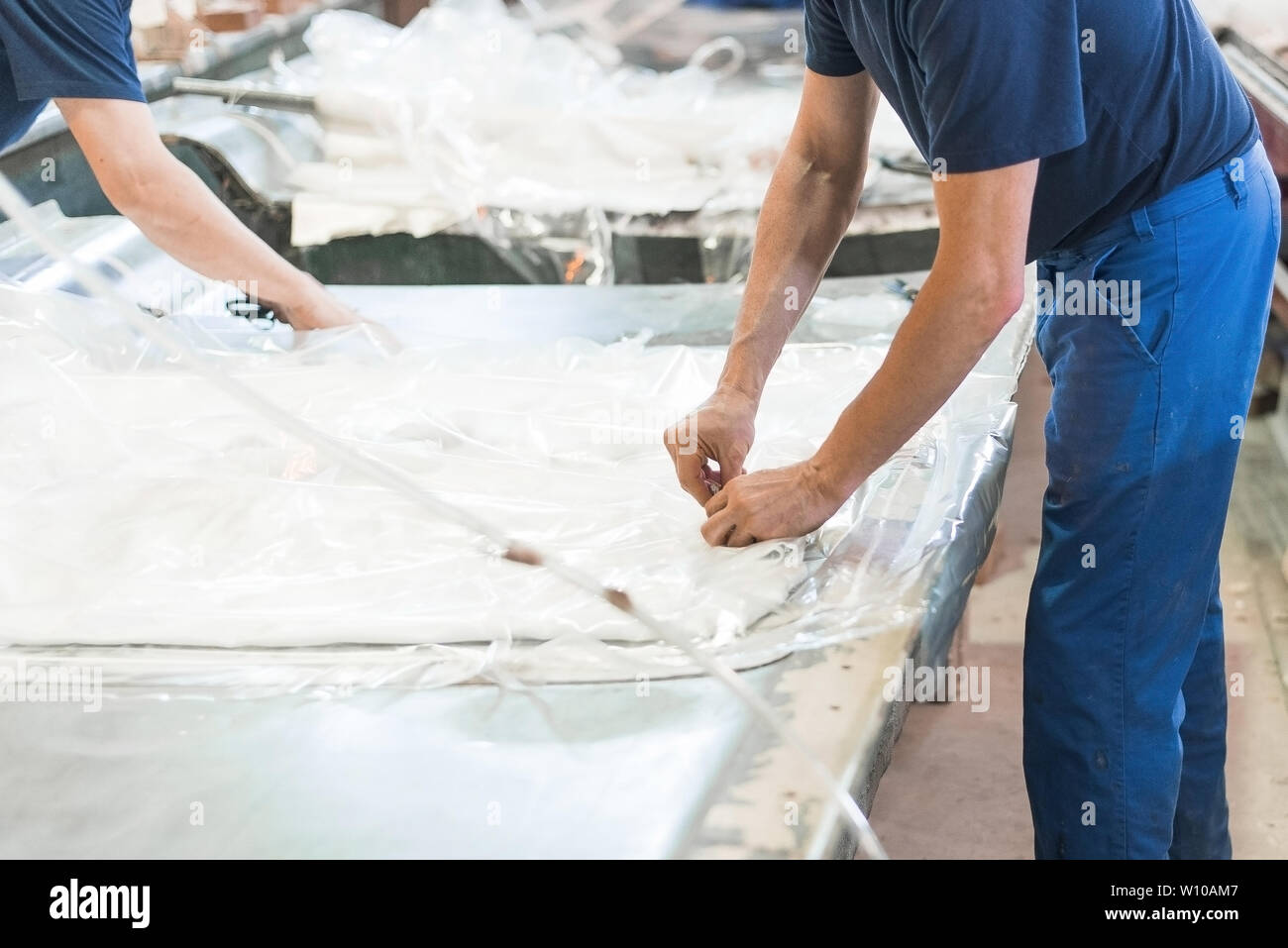 factory worker working with polyethylene Stock Photo - Alamy