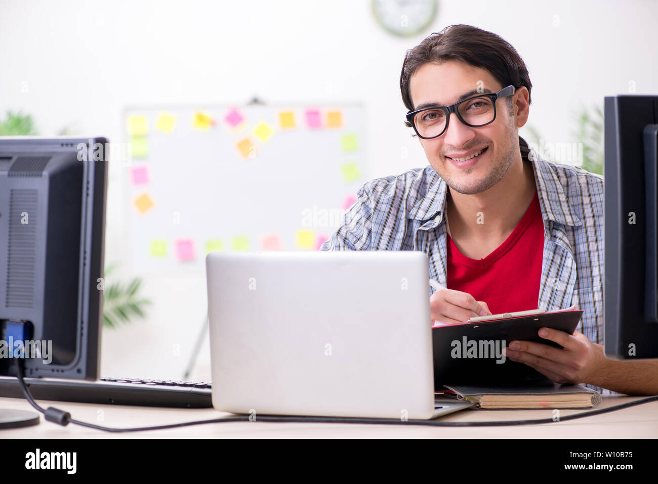 Male it specialist working in the office Stock Photo - Alamy