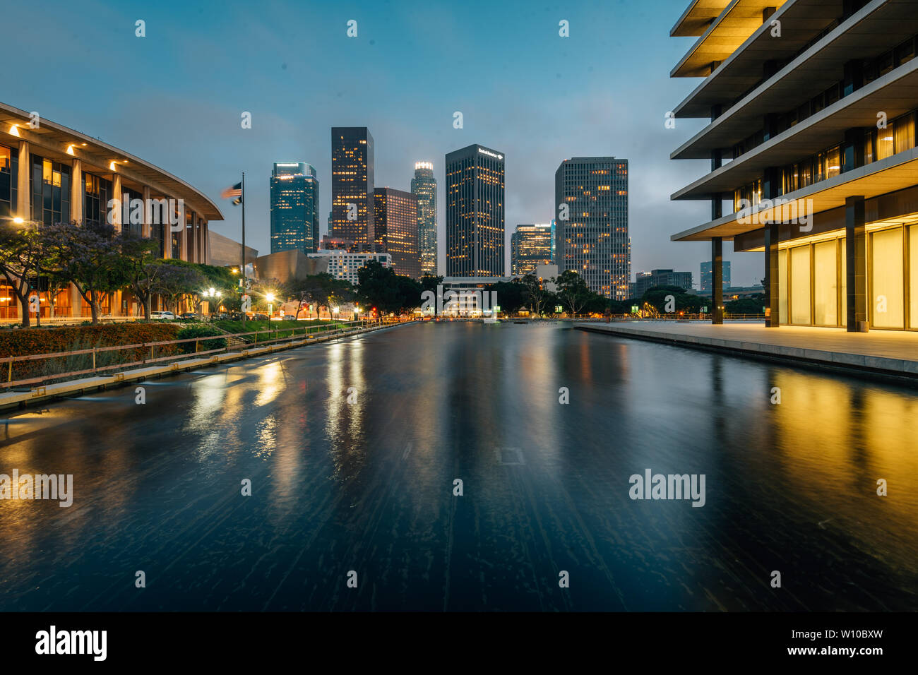 The downtown Los Angeles skyline at night, with the reflecting pool at ...