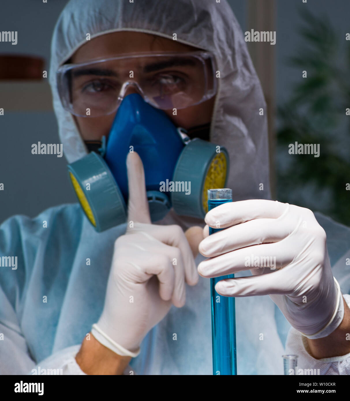 Young make scientist working with dangerous hazardous substances Stock ...
