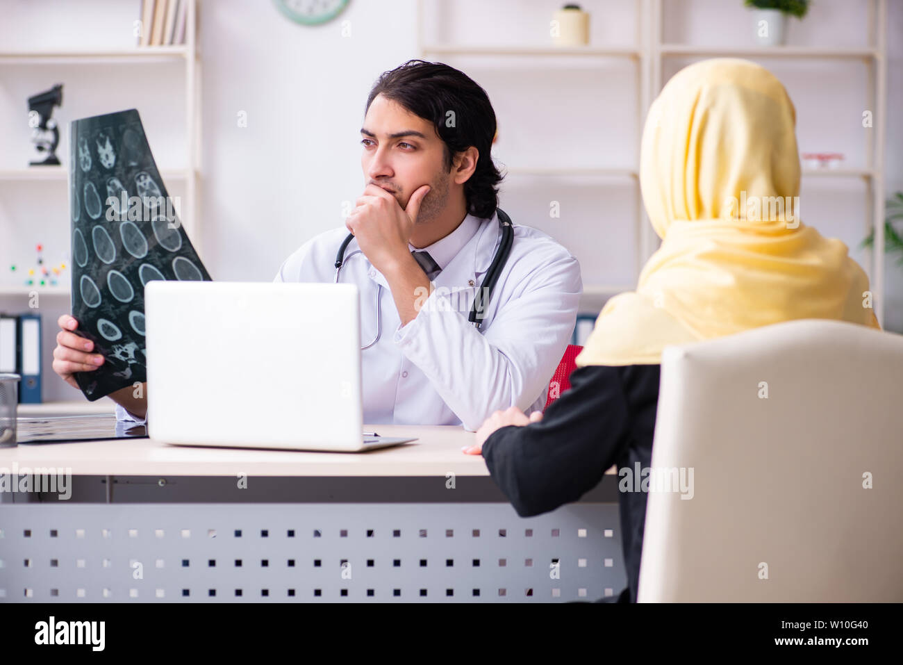 Female arab patient visiting male doctor Stock Photo - Alamy