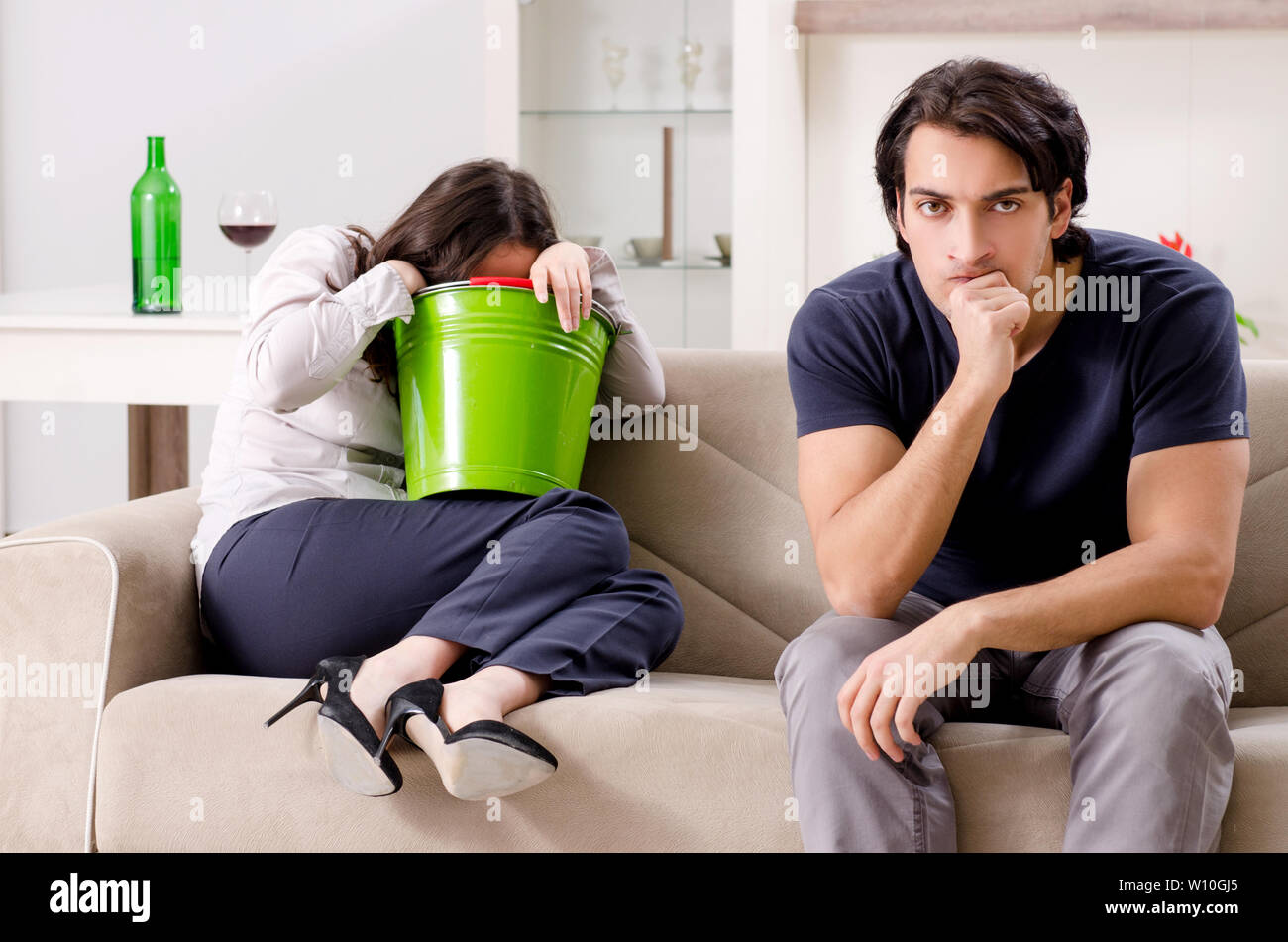 Young wife suffering from sick stomach and vomiting Stock Photo - Alamy