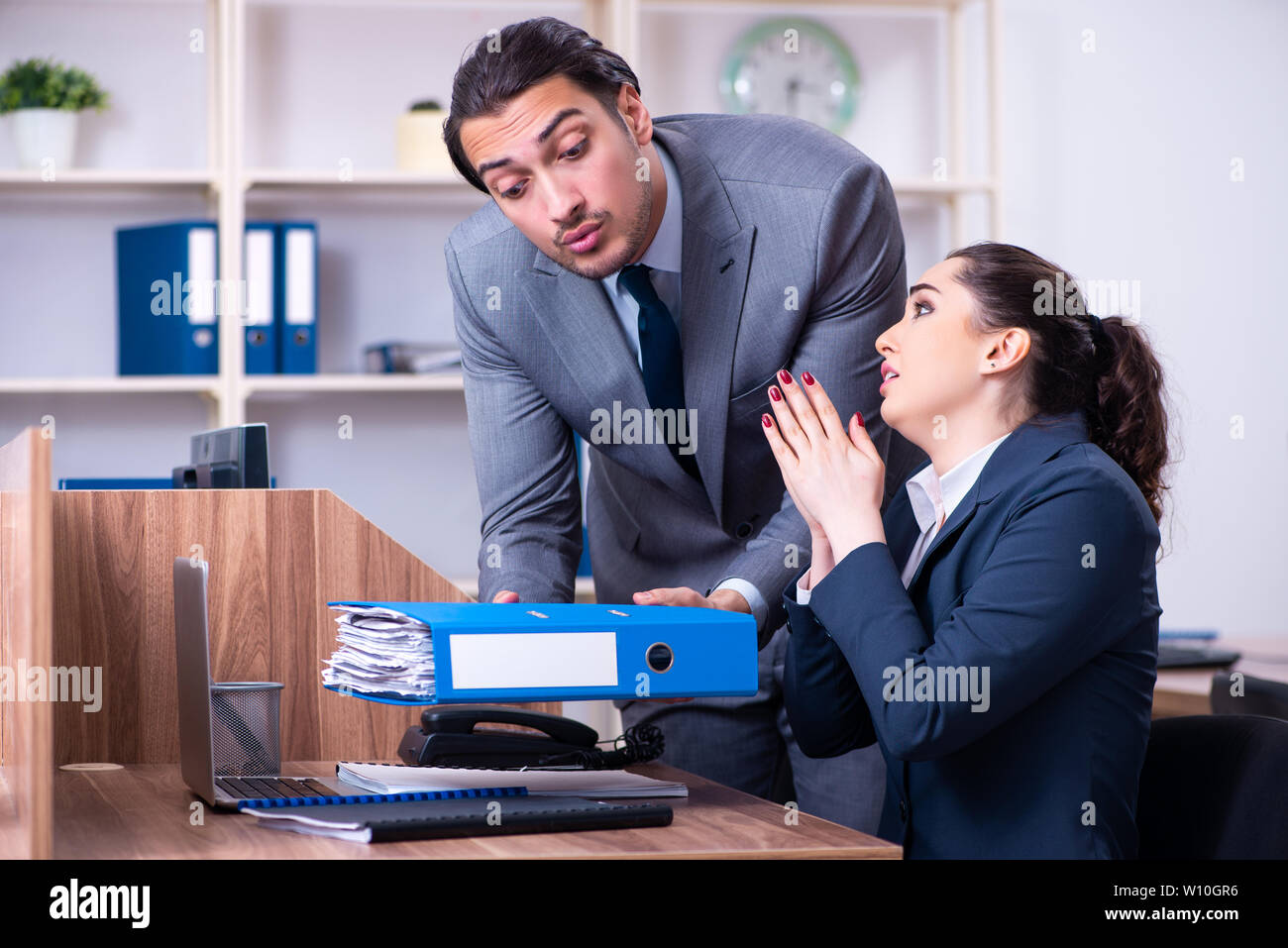 Two employees working in the office Stock Photo - Alamy