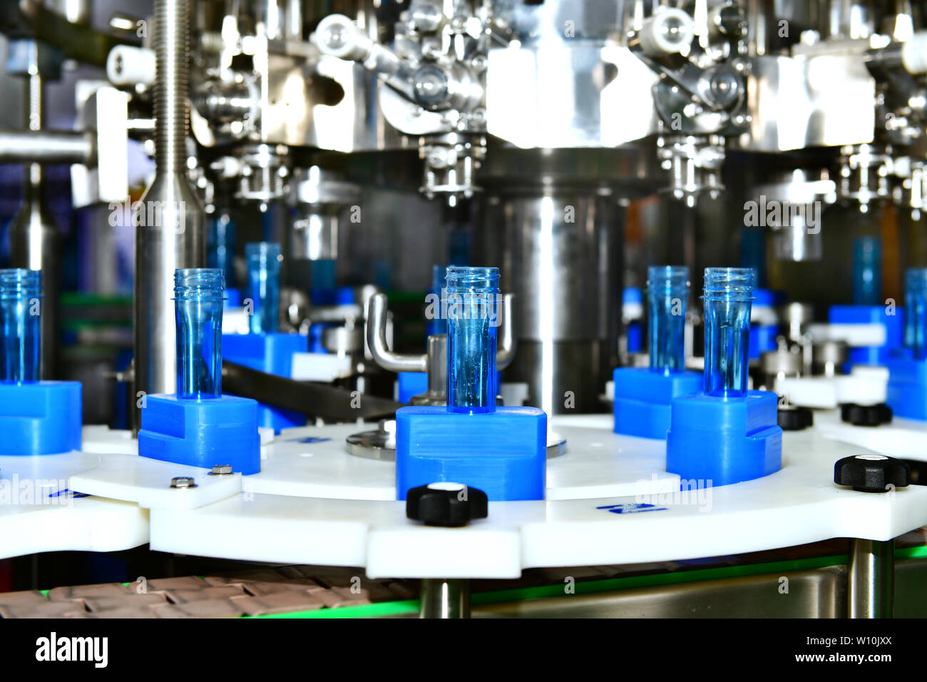 Clear plastic Bottles transfer on Automated conveyor systems industrial ...