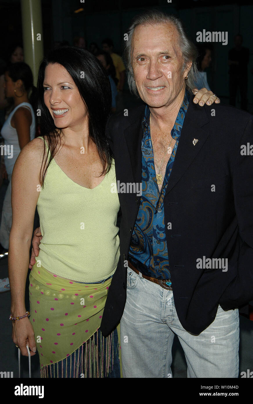 David Carradine and Annie Bierman at the Premiere of "Hero" at The ...