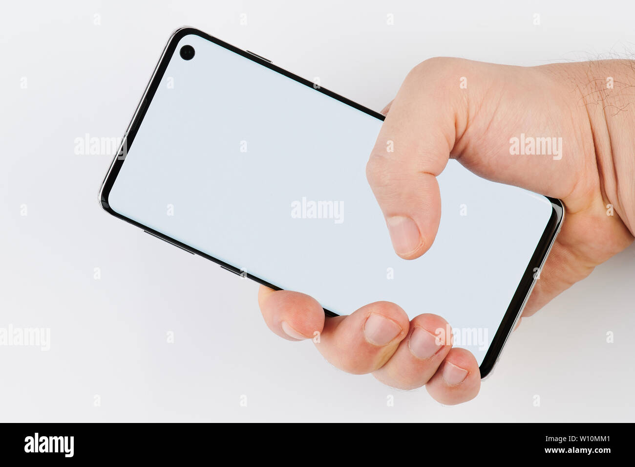 Hand hold modern smartphone isolated on white background Stock Photo ...