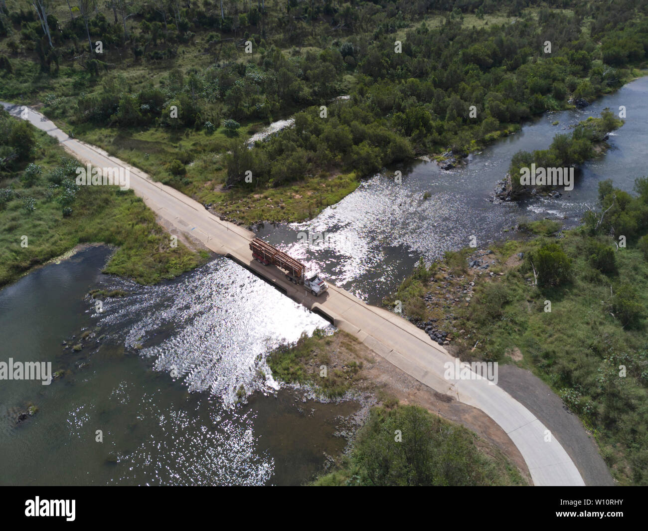 Logging truck river hi-res stock photography and images - Alamy