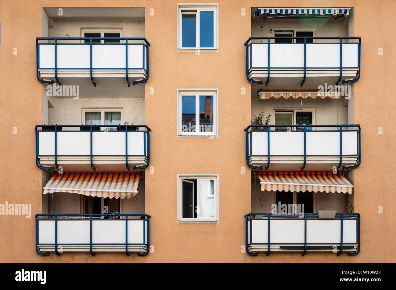 Symmetrical rows of white balconies on an apartment block Stock Photo ...