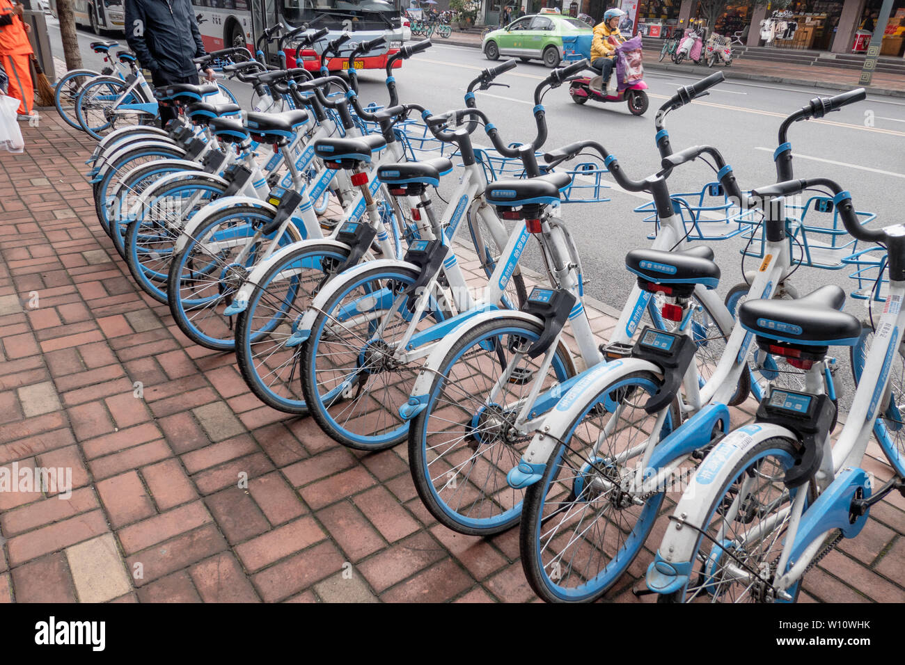 Chengdu, China - Oct 25 2018 : Rows of bike for rent on footpath to ...