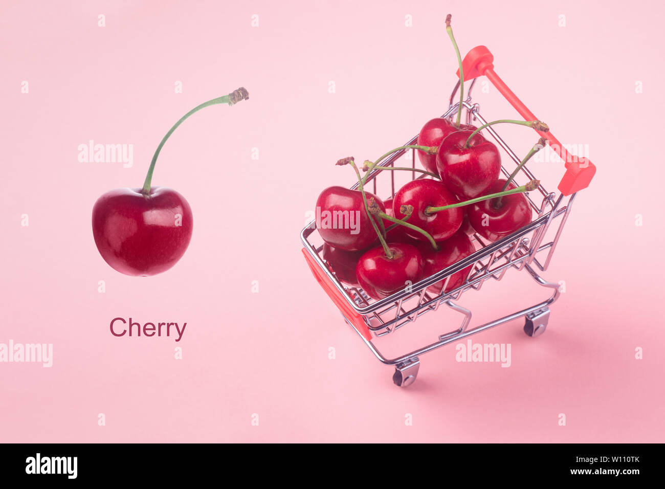 Creative layout made of red cherry, over pink background, creative ...