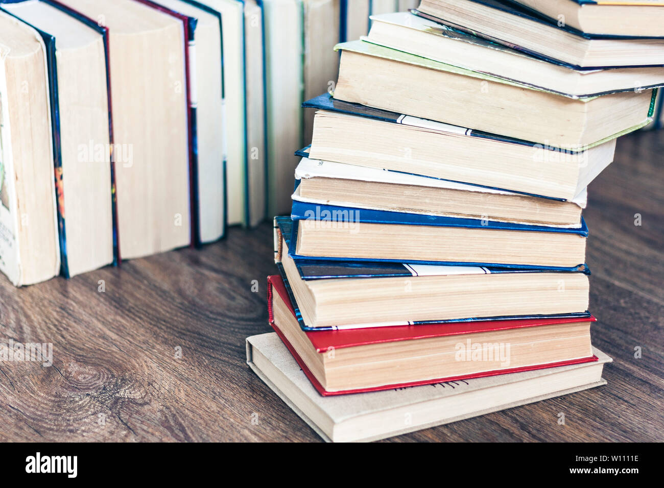 Stack of books education background, many books piles with copy space ...