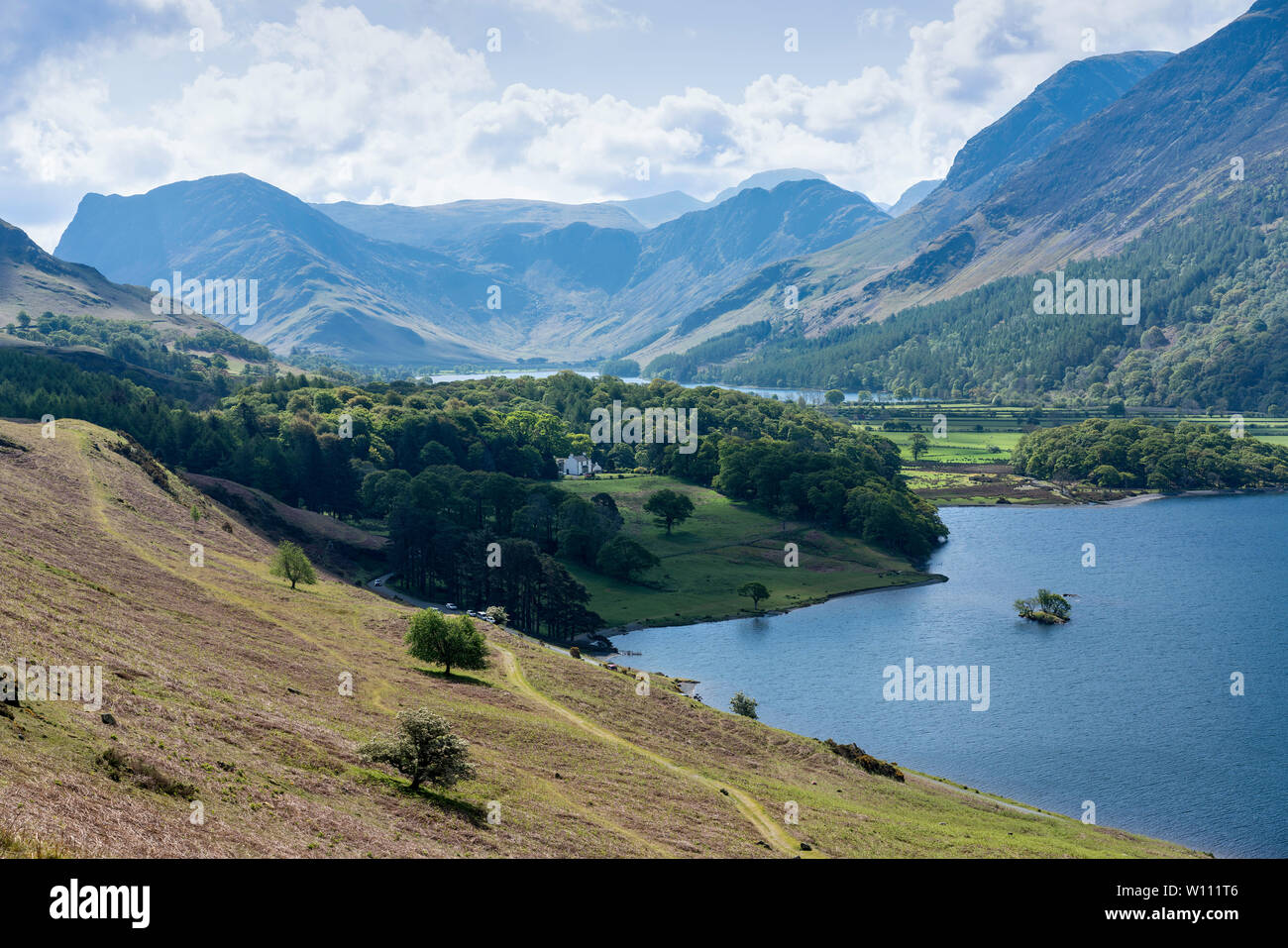 Spring time views of woodland and fells overlooking Crummock Water and ...