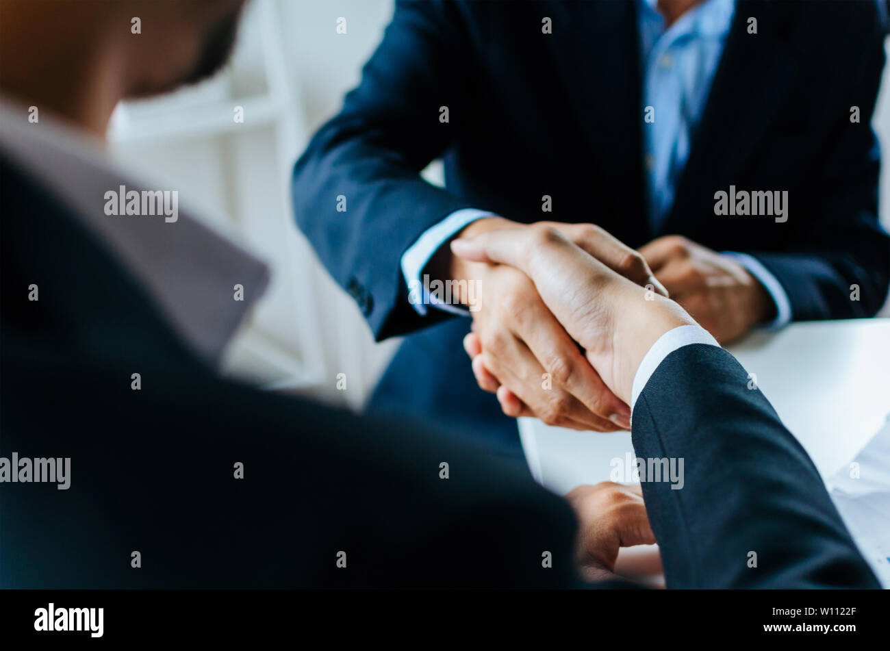 Partnership. two business people shaking hand after business job ...