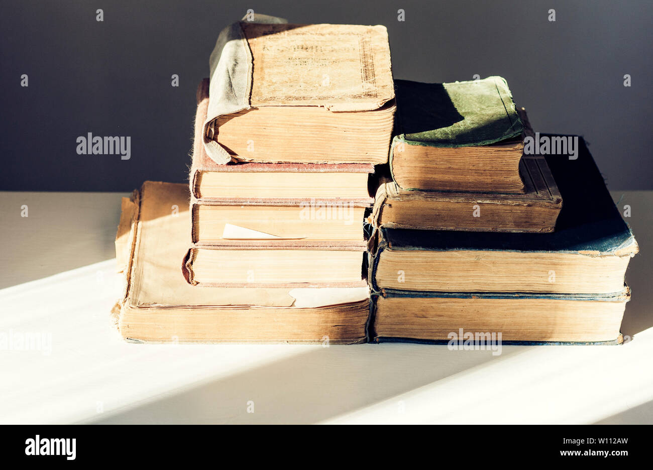 Stack of old books education retro concept background, many books piles ...