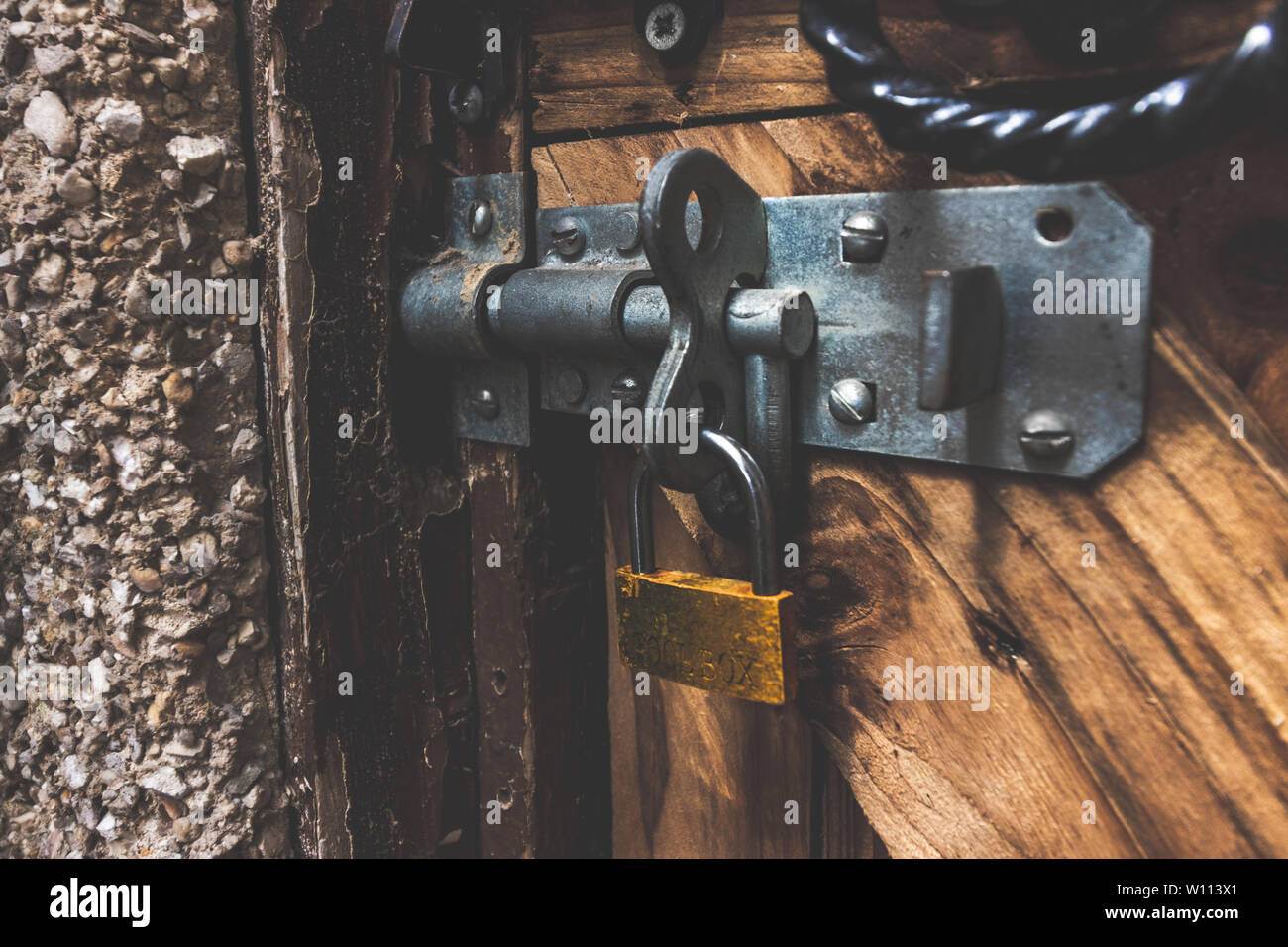 Golden Padlock on Wooden Gate/Door with Lock and Handle showing ...