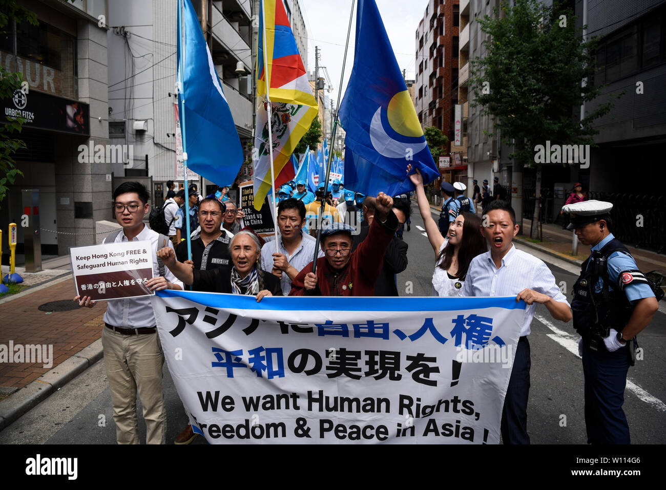 Osaka, Japan. 29th Jun 2019. Activists for China Uyghur ethnic minority ...
