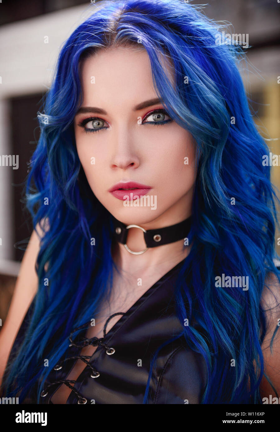 Closeup portrait of a beautiful young girl (informal model) with blue ...