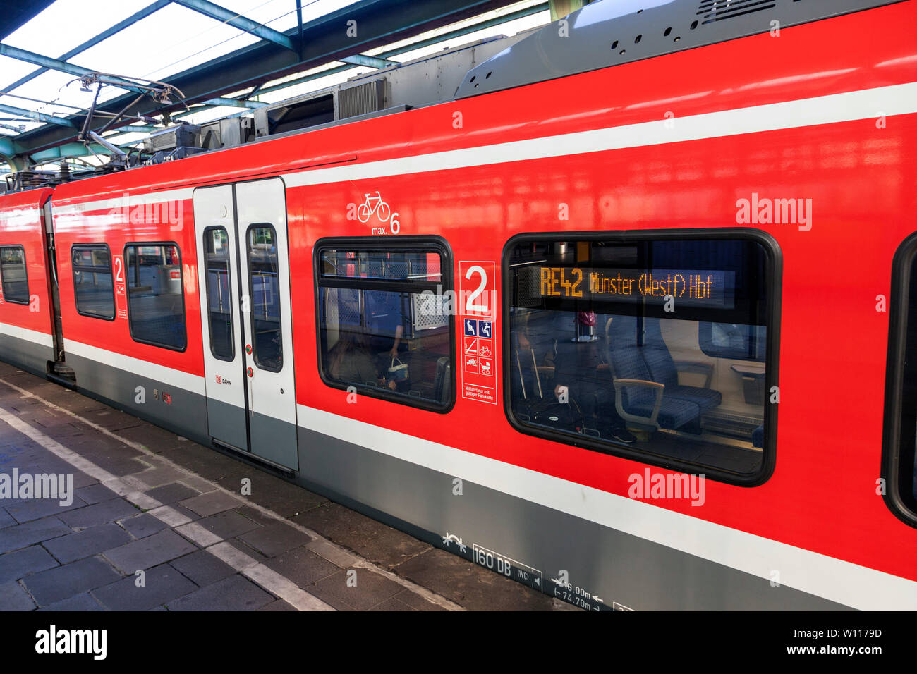 Commuter train on the station Stock Photo - Alamy