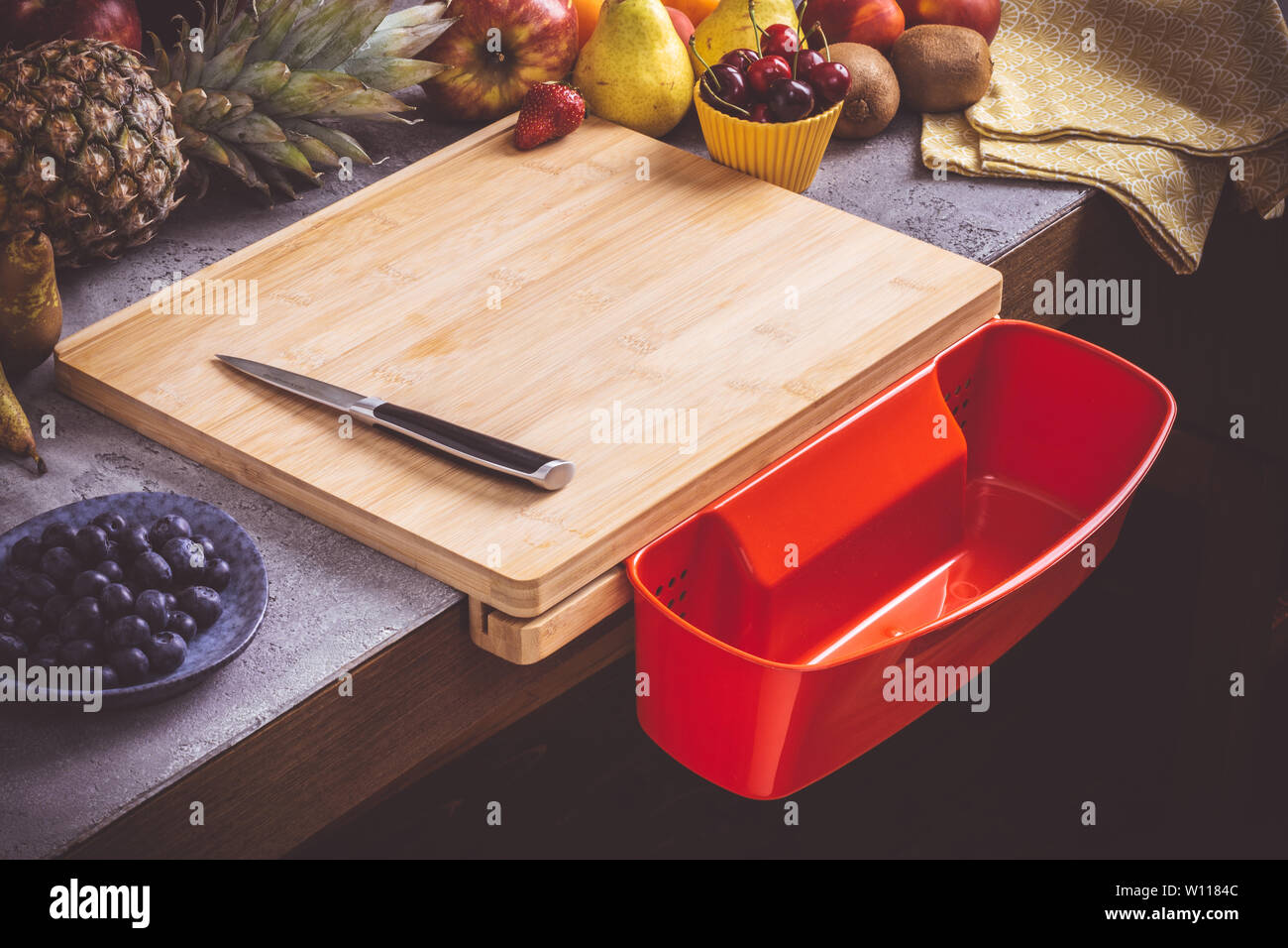 Chopping Board with Red Waste Container with Fresh Fruits Background ...
