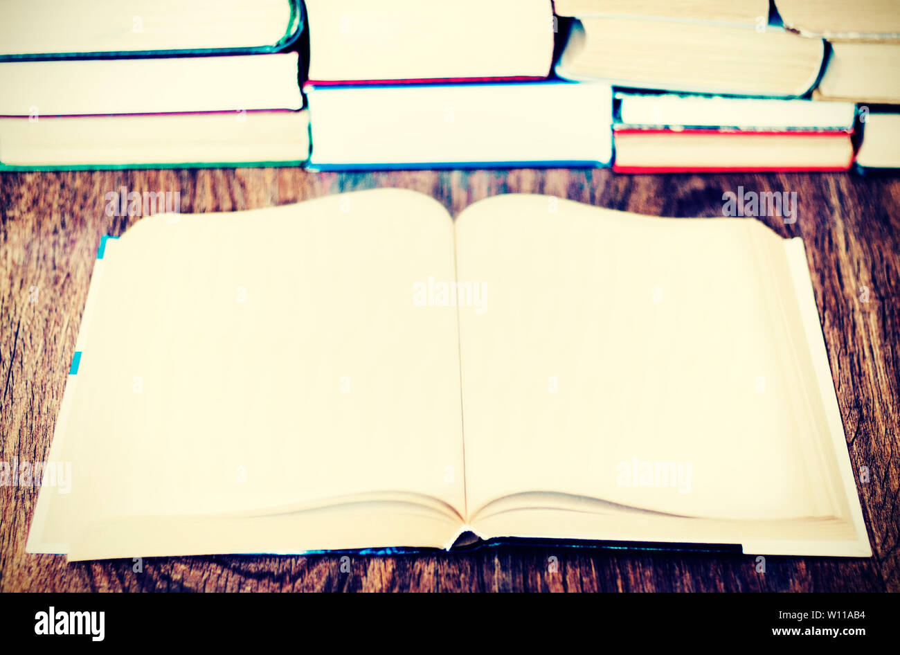 Open book with empty page and stack of old book education concept ...