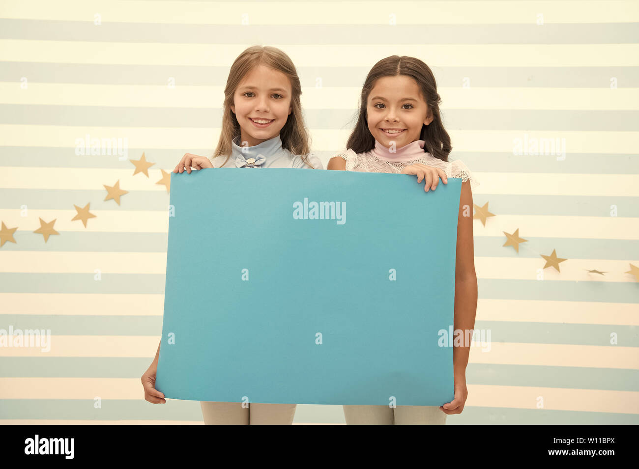 Your advertisement in good hands. Girls kids hold advertisement poster ...
