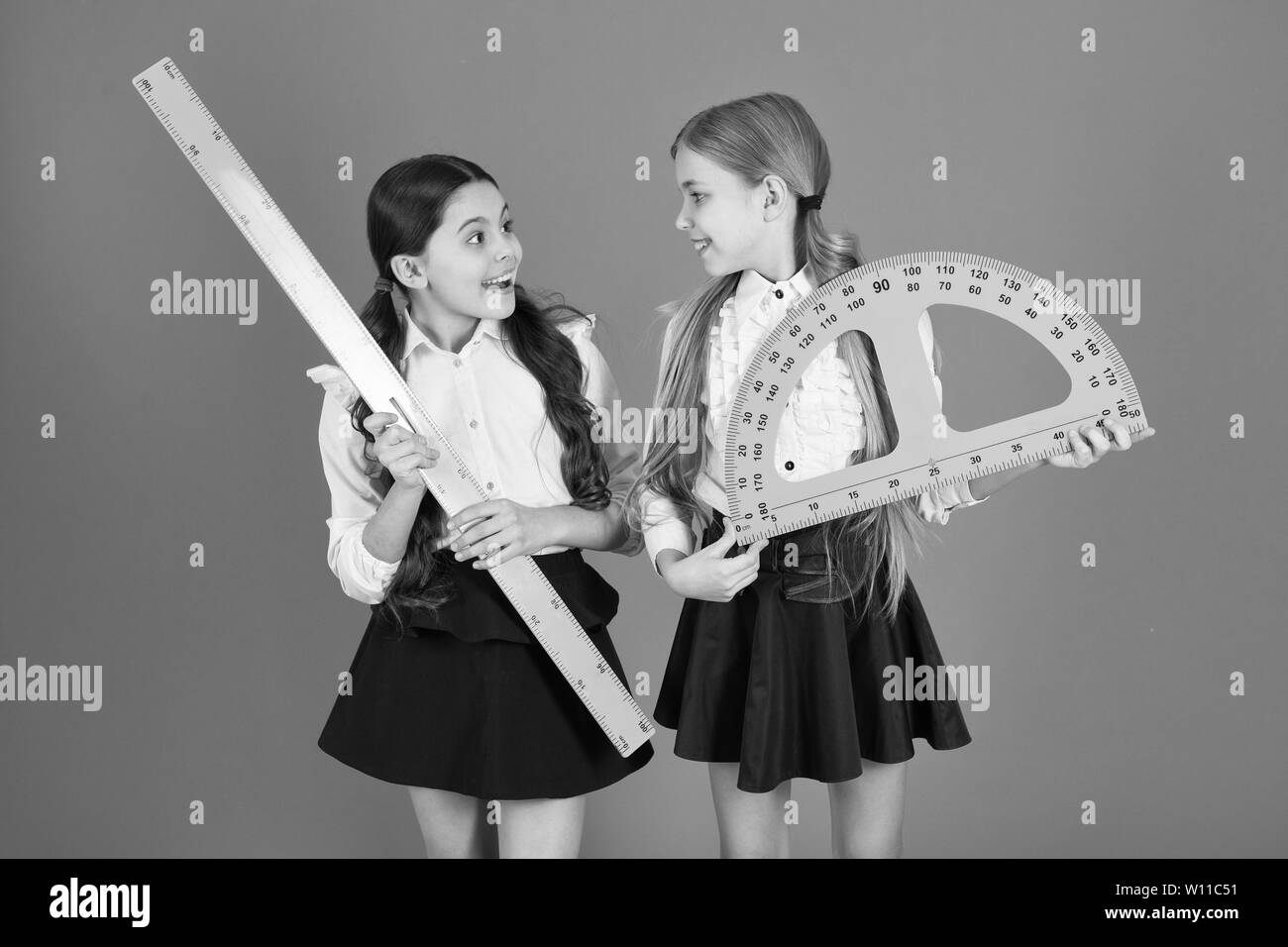 For good measure. School children with measuring instruments. Little ...