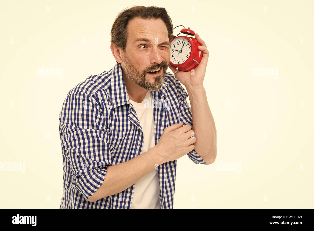 Time is short. Bearded man listening to clock ticking sound. Aged man ...