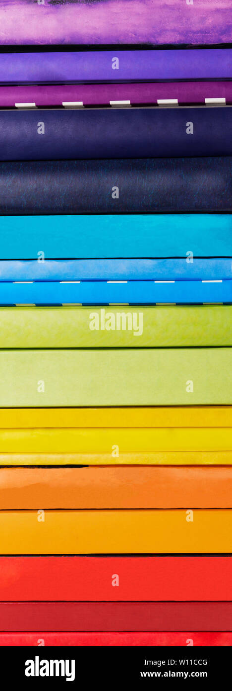 Stack of colorful rainbow books on white background Stock Photo - Alamy