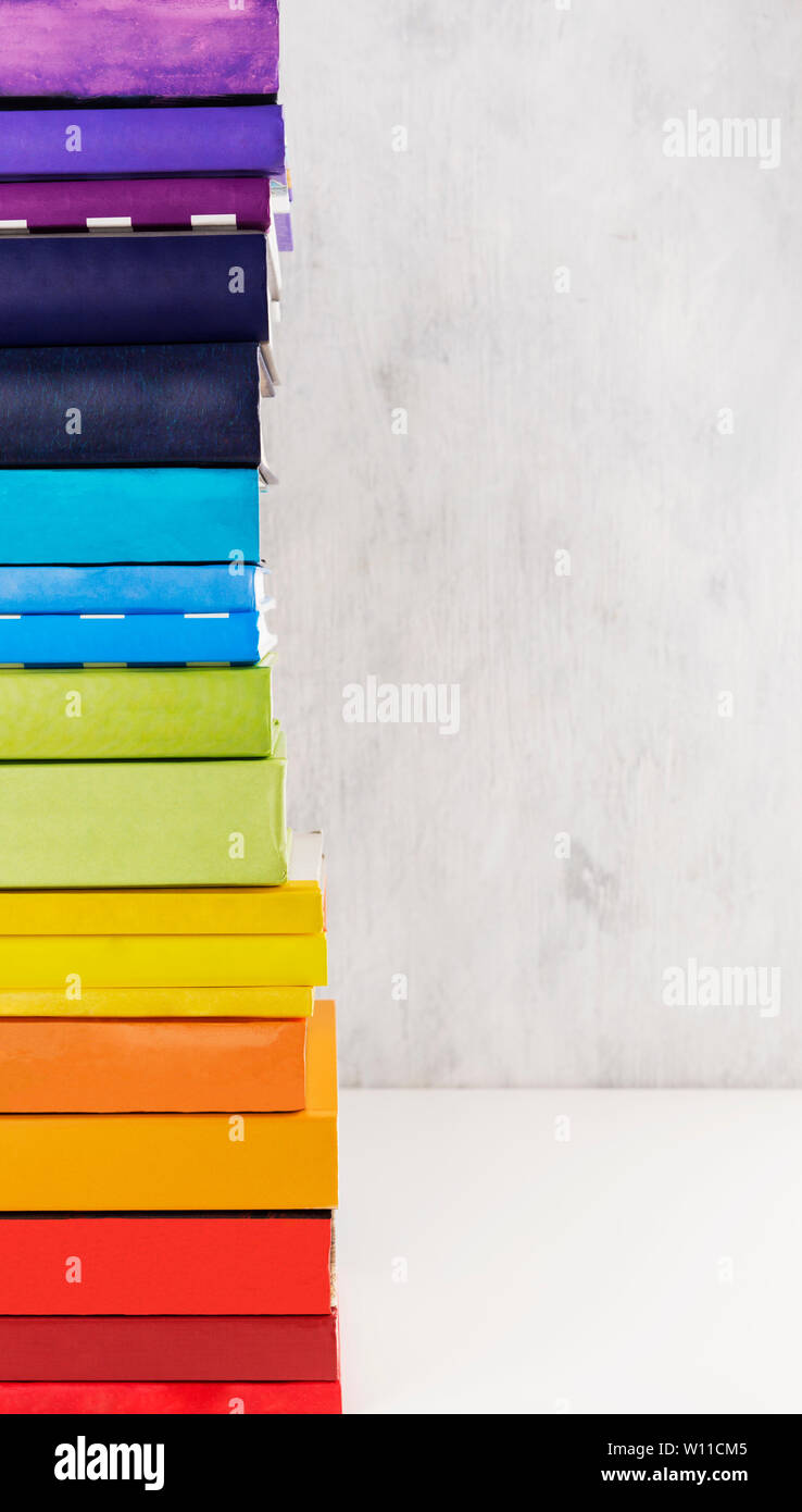 Stack of colorful rainbow books on white background. Copy space Stock ...